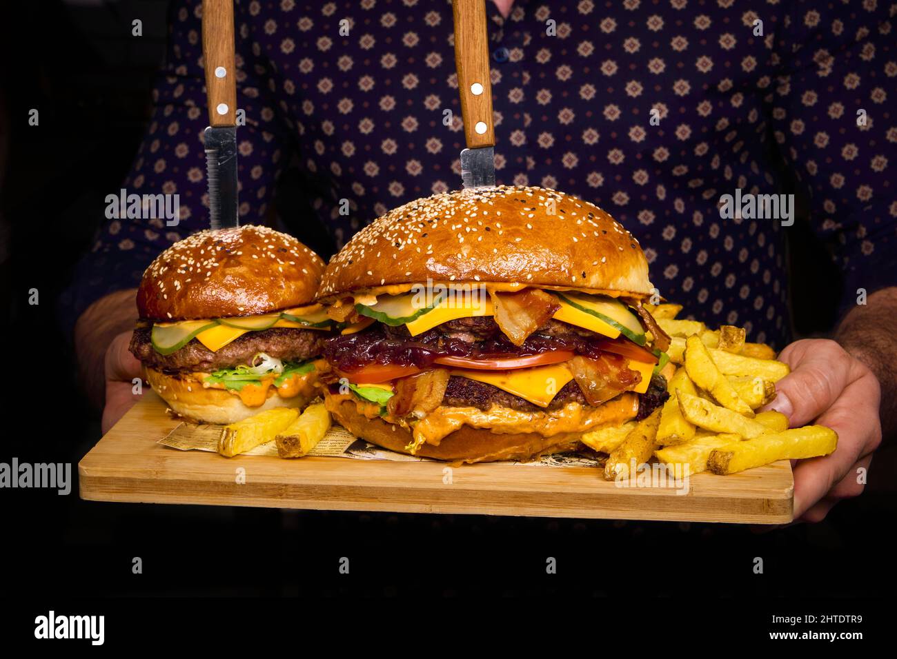 Closeup of a hamburger fast food with fries Stock Photo - Alamy