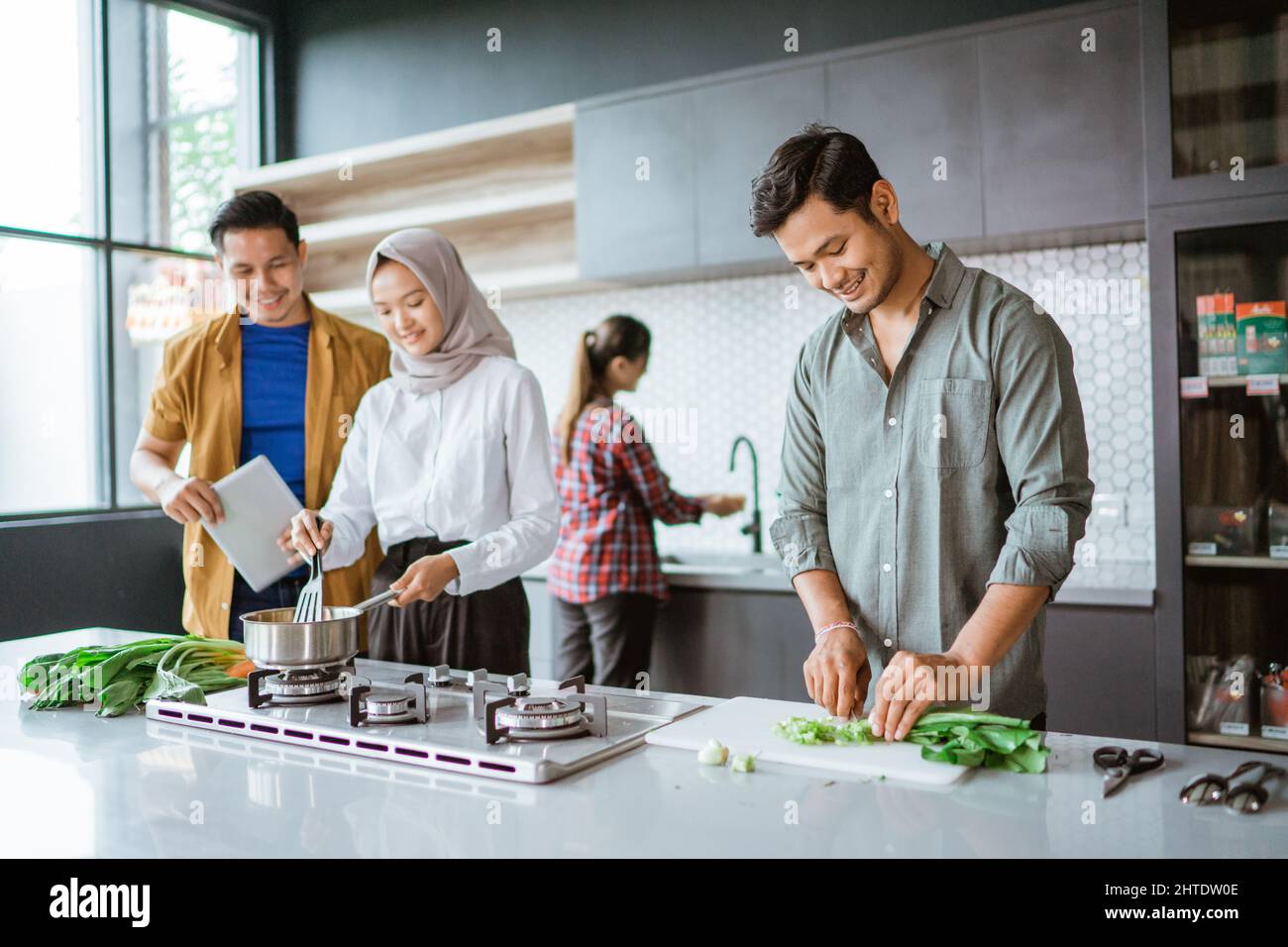 Group of cooks in the kitchen hi-res stock photography and images - Alamy
