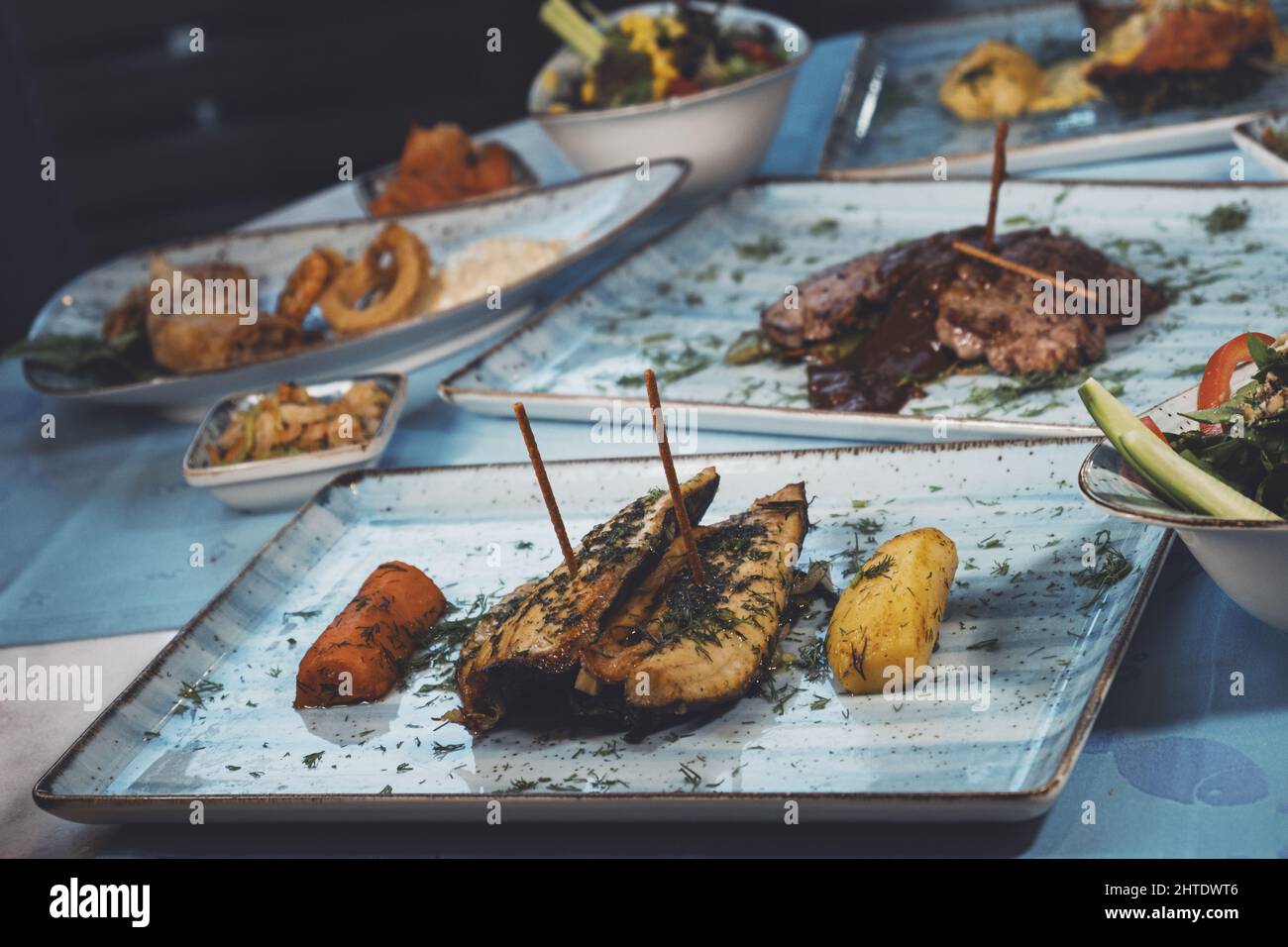 Different types of fried food with sticks on the table Stock Photo - Alamy