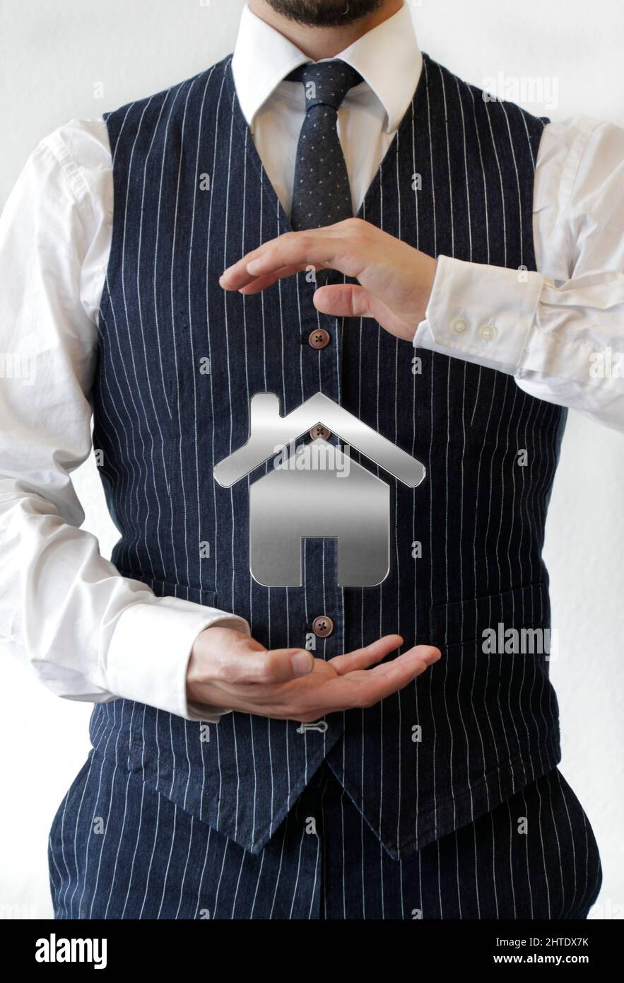 Hands protecting house hi-res stock photography and images - Alamy