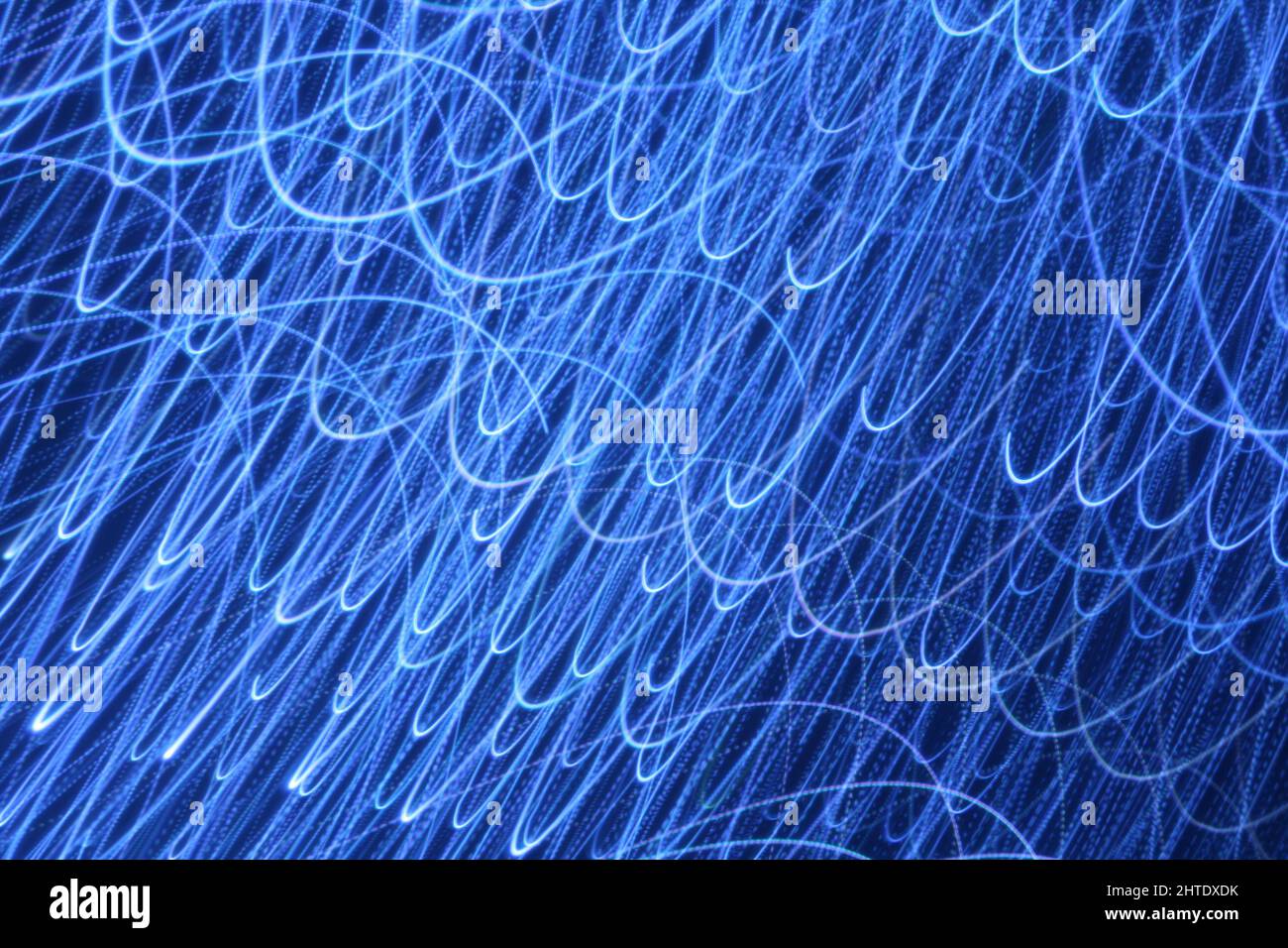 Illustration of neon blue electrons in the light source gaining and ...