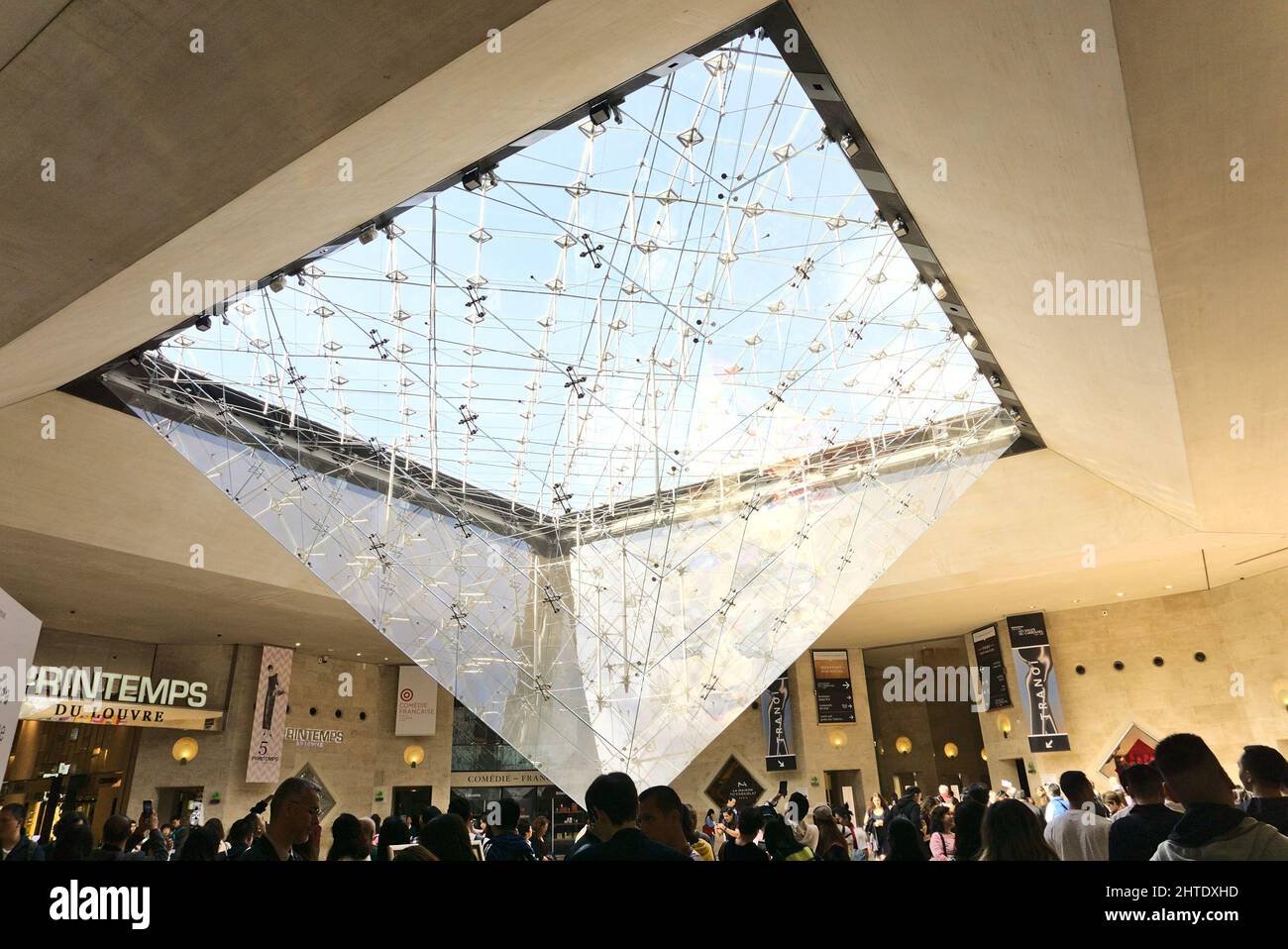 Inverted glass pyramid inside underground department store under the ...