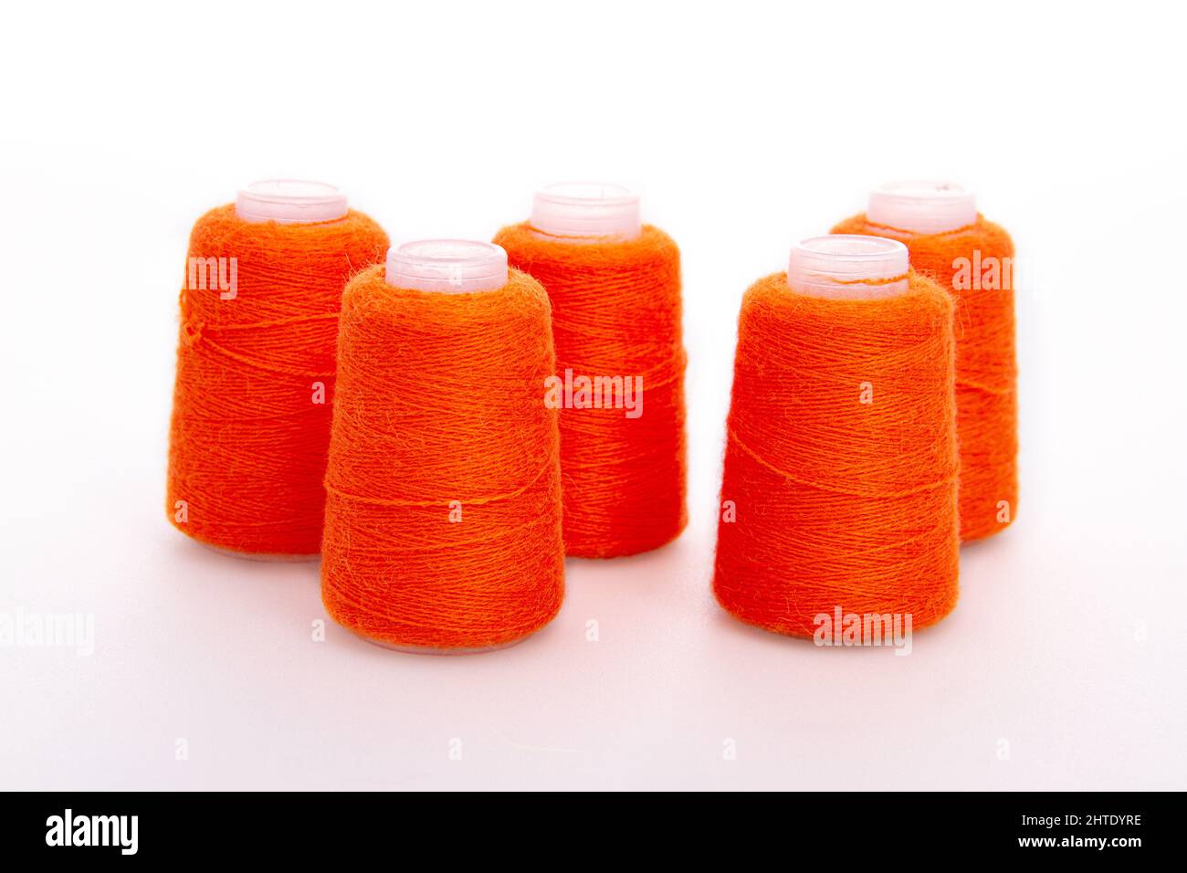 Red spool of thread isolated on white background. Skein of woolen ...