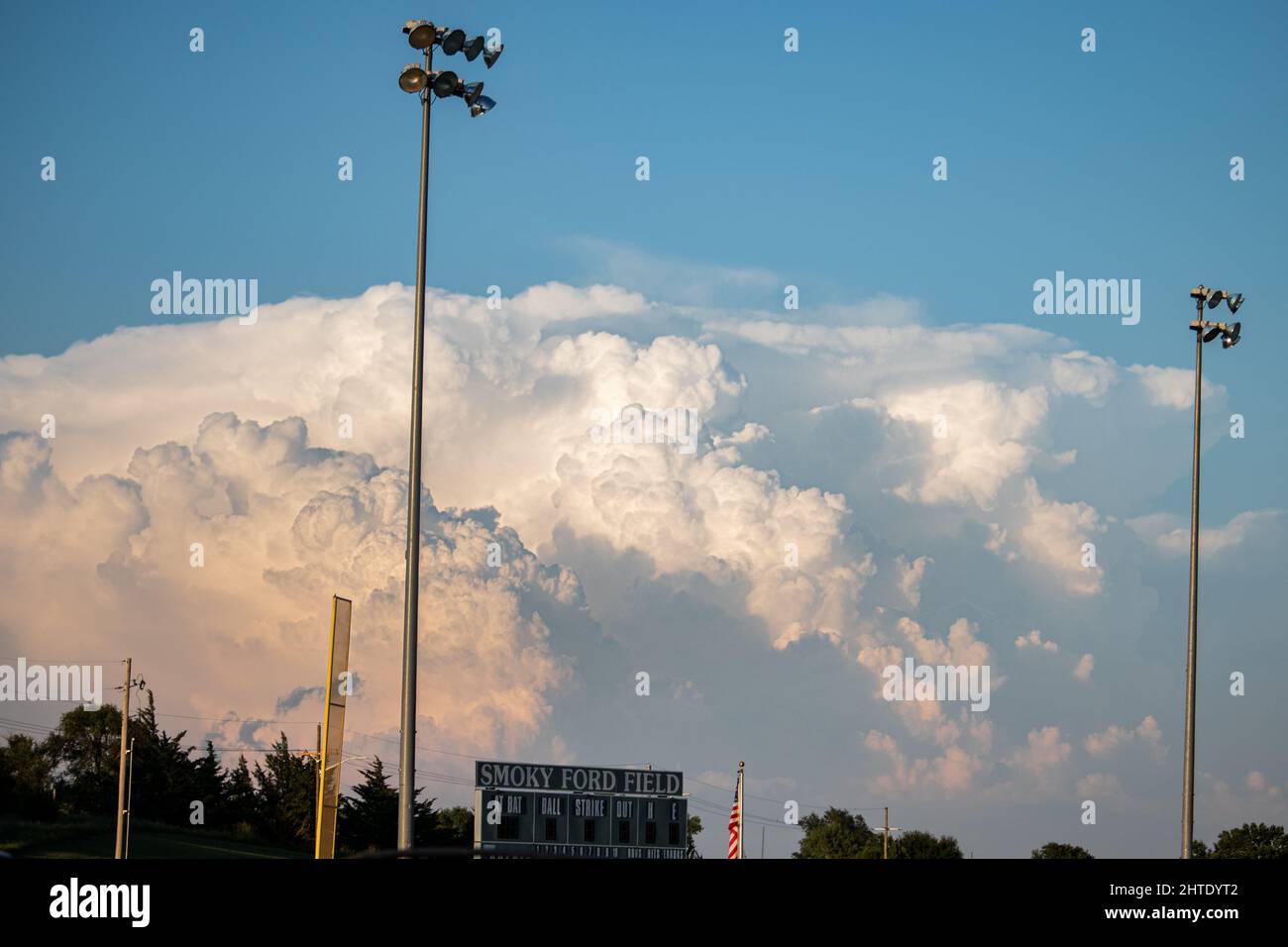 Blue sky with big clouds on top of a field Stock Photo - Alamy
