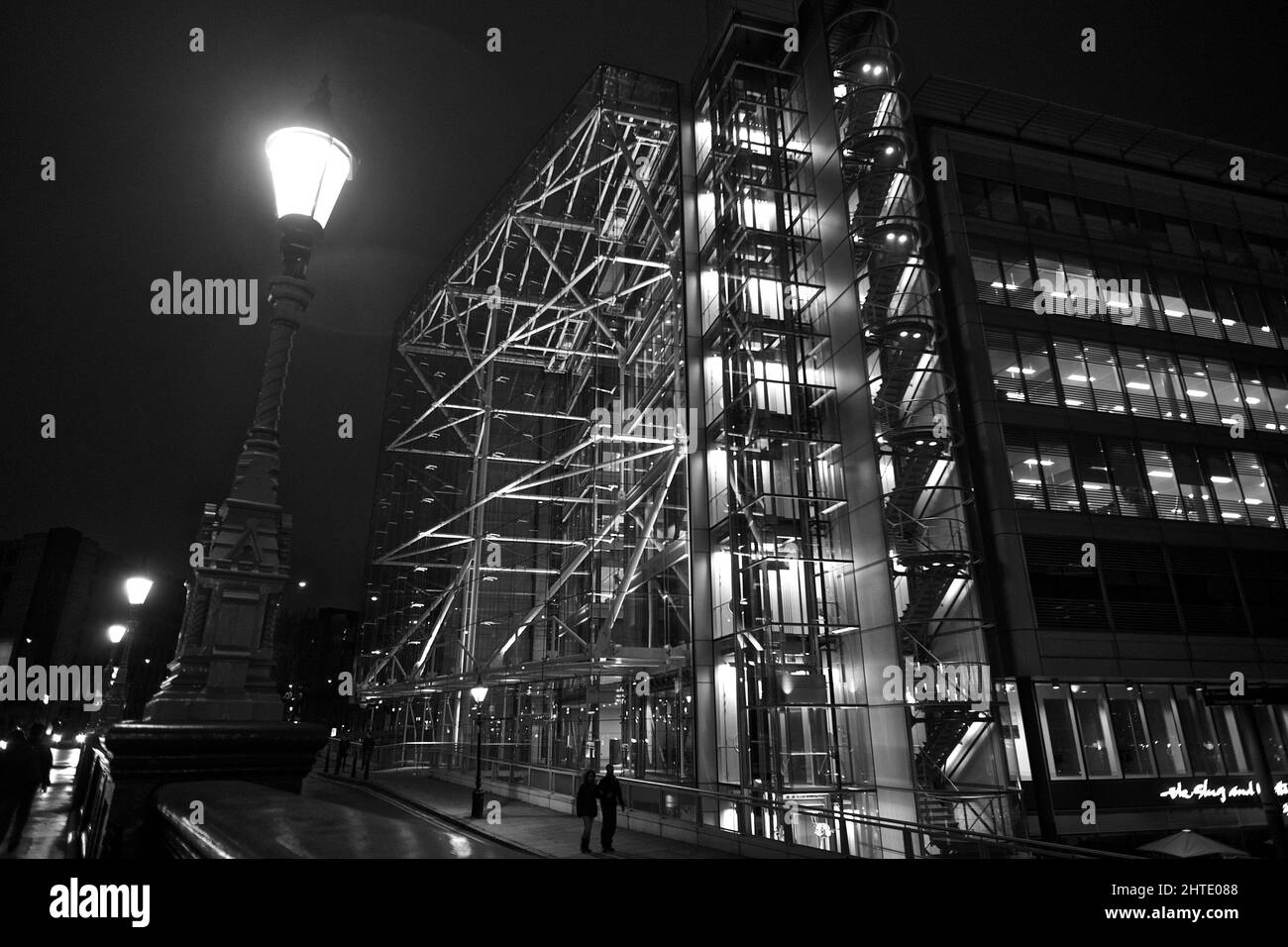Grayscale of a modern building in Westminster, London during nighttime ...