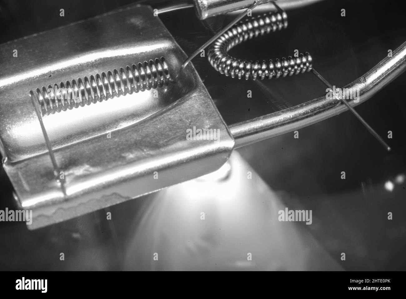 Closeup shot of the light bulb and the springs on the glass in ...