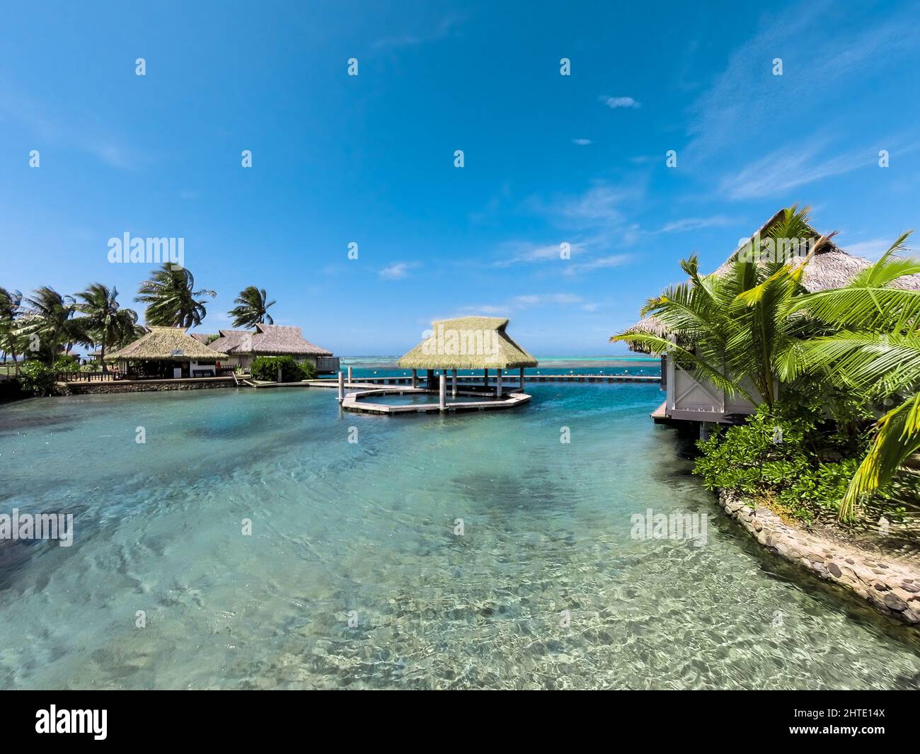 Stilts houses in Dolphin center in Moorea Island Stock Photo - Alamy