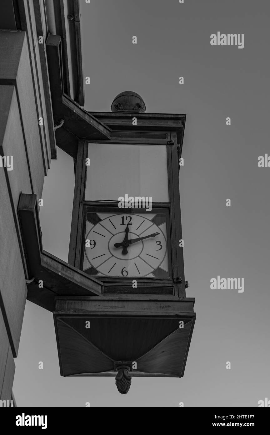 Grayscale of a clock on the wall Stock Photo - Alamy