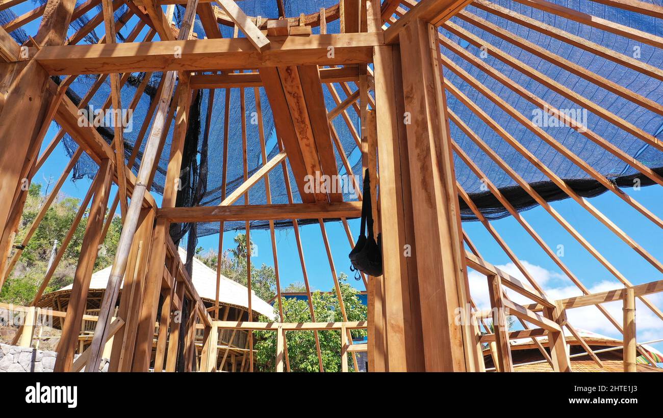 Inside a timber house under construction. Detailed photo of a wooden ...