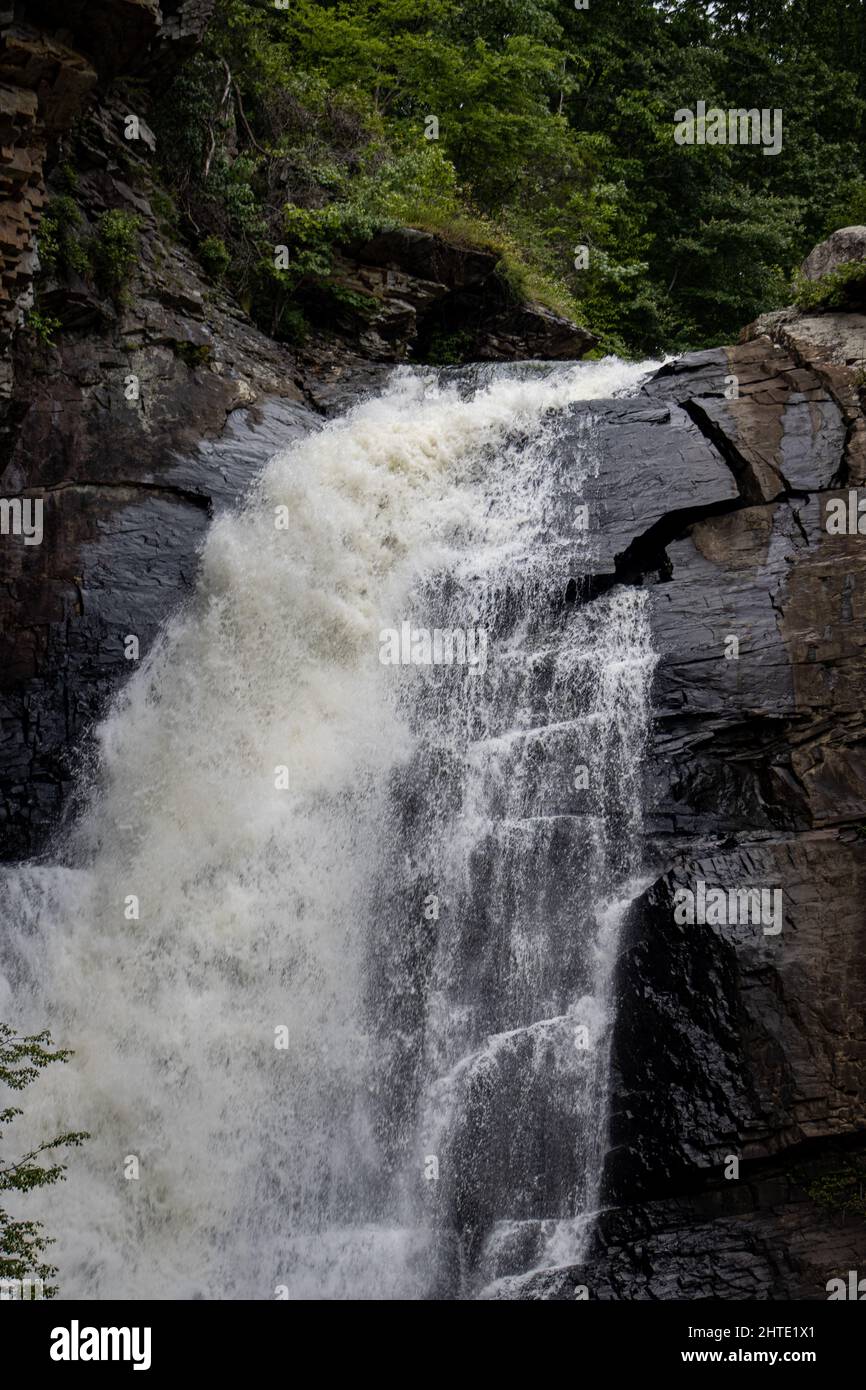 Vertical shot of raging waterfalls over big rocks Stock Photo - Alamy