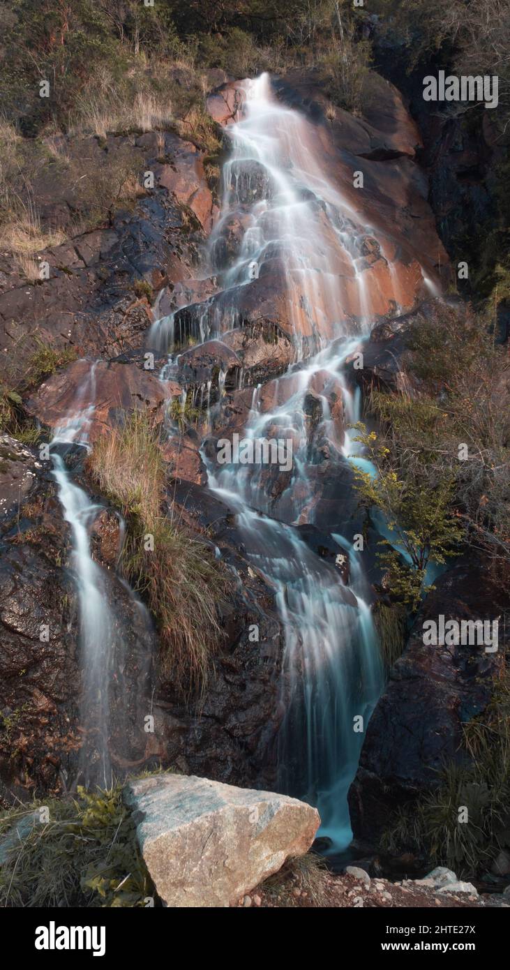 Vertical shot of a fresh water stream running down mountain side Stock ...