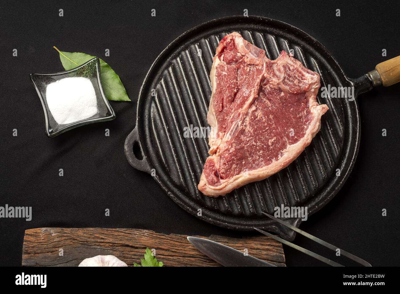 Top view of a raw steak meat with spices around Stock Photo - Alamy