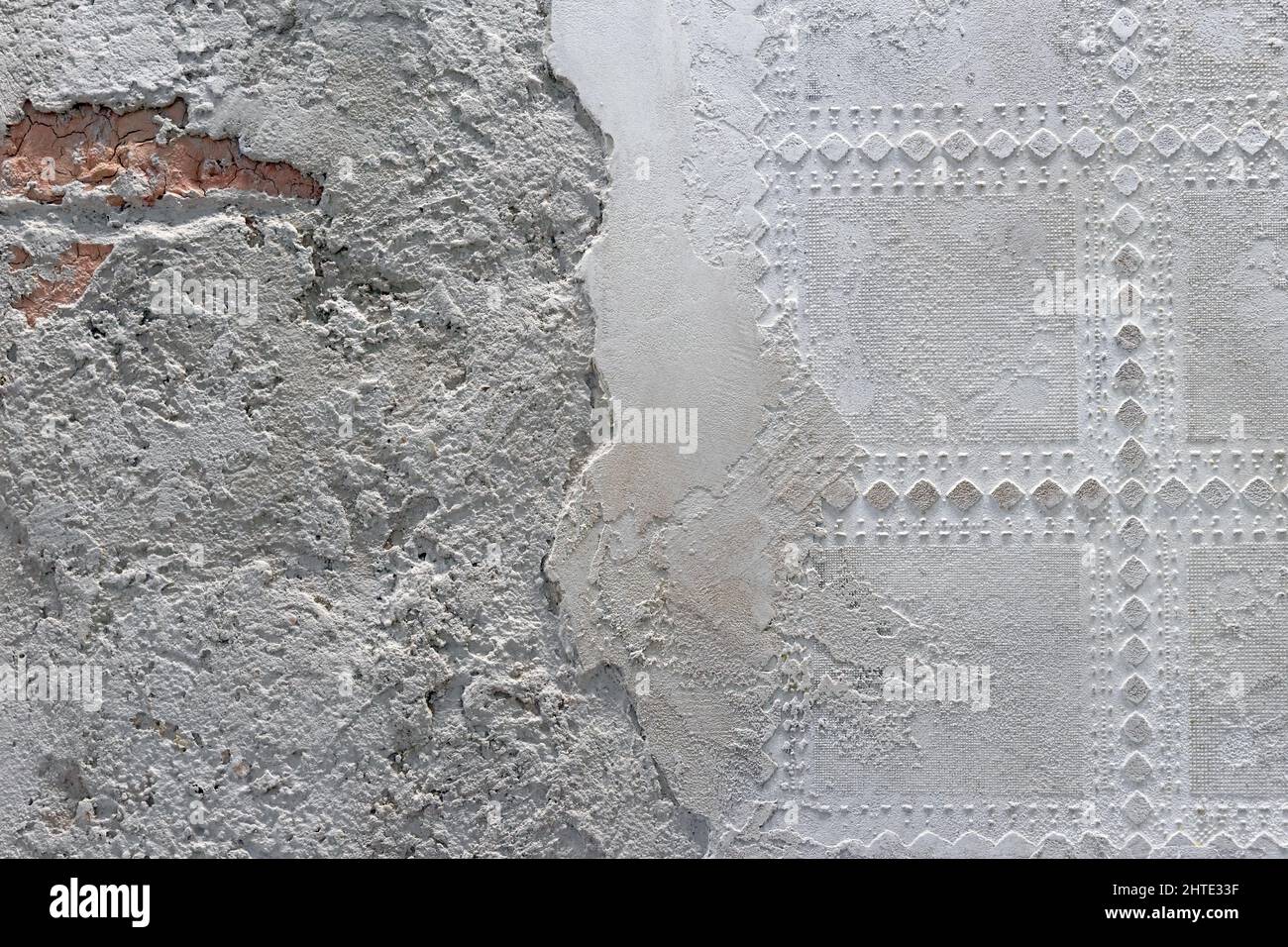 Damaged plaster on brick wall background. Brickwork under crumbling ...