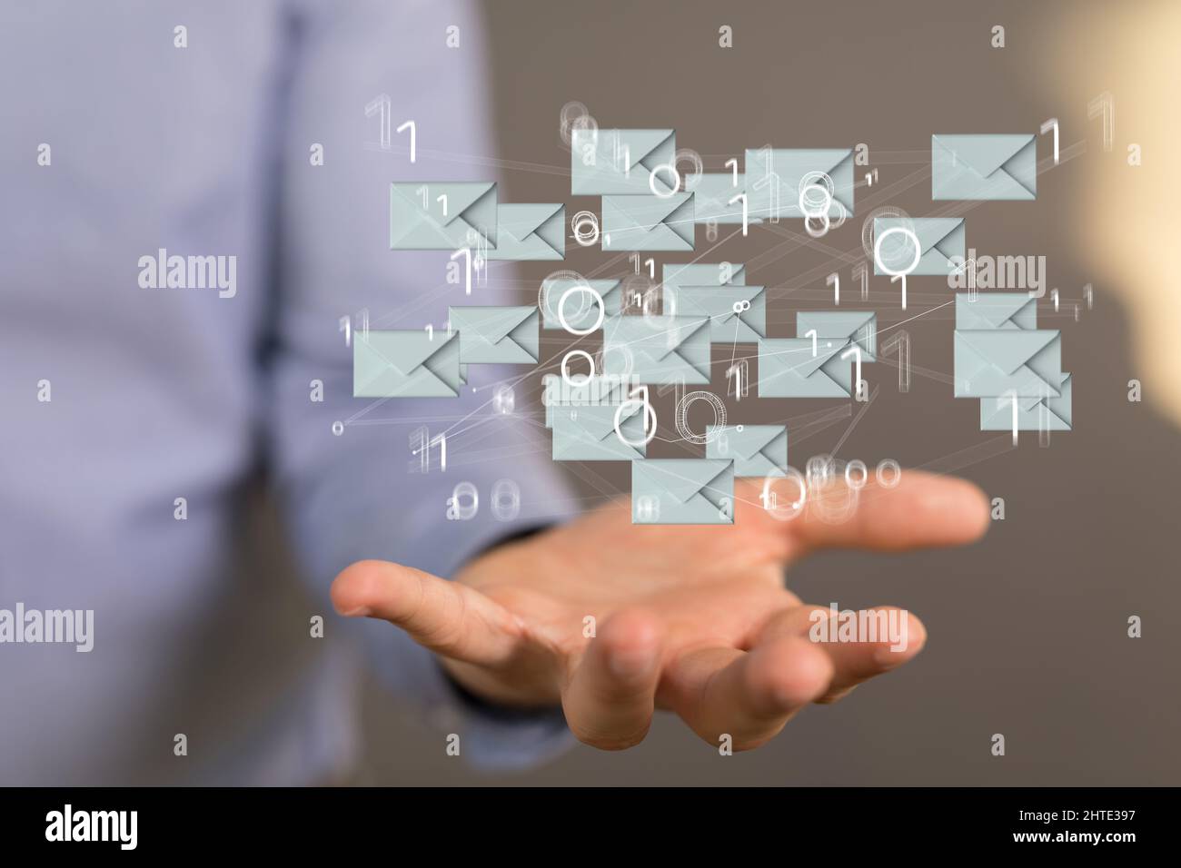 Male showing a mobile phone with email icons on the screen - concept of ...