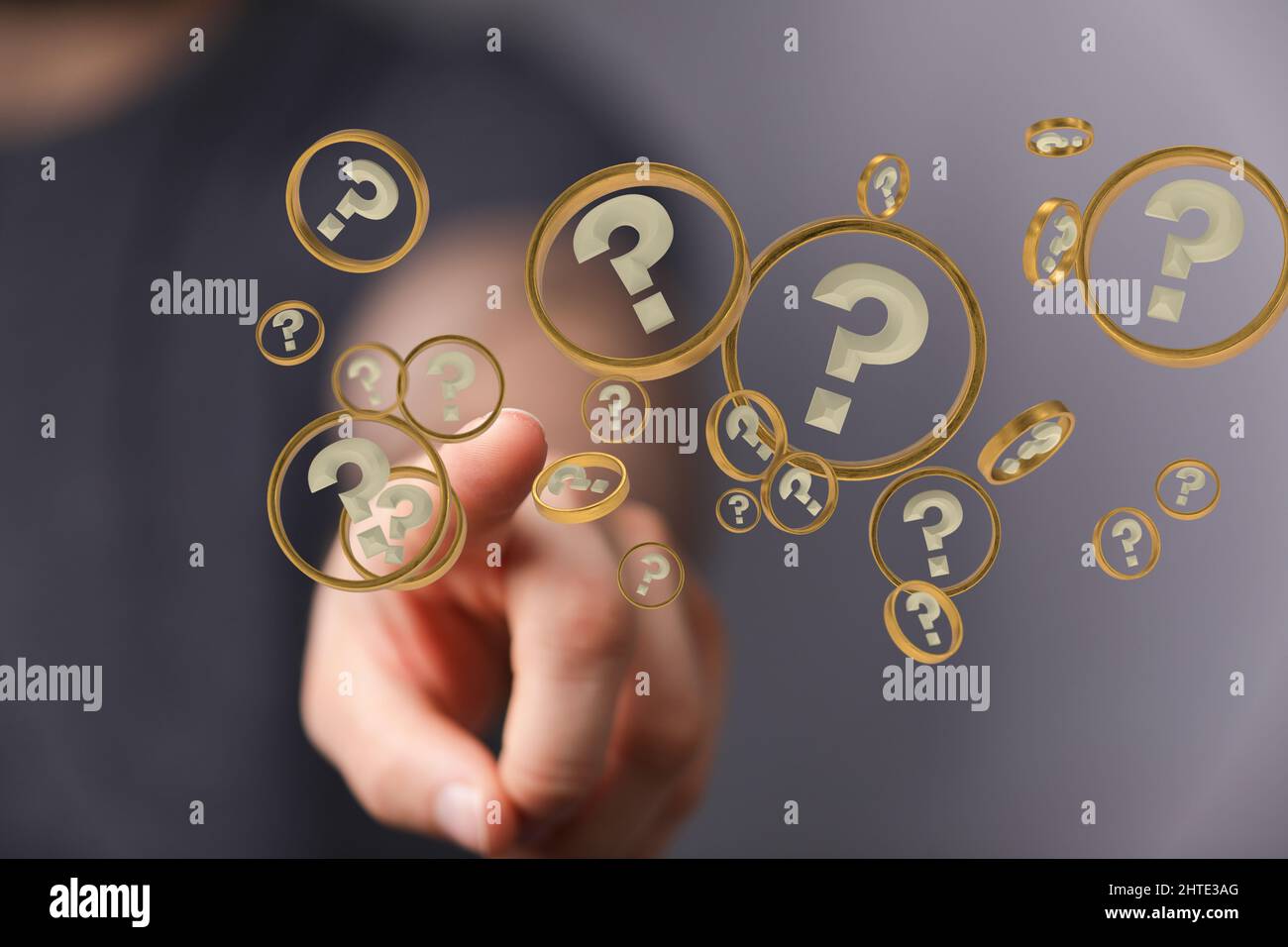 Male pointing at 3D question marks Stock Photo - Alamy