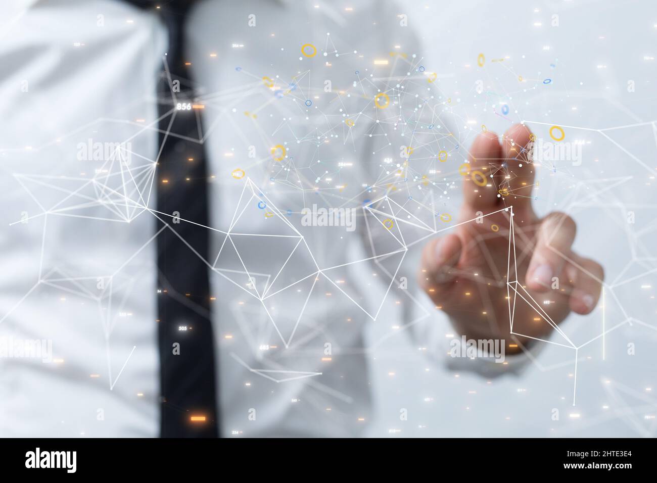 Businessman pointing at digital business people silhouettes - network ...