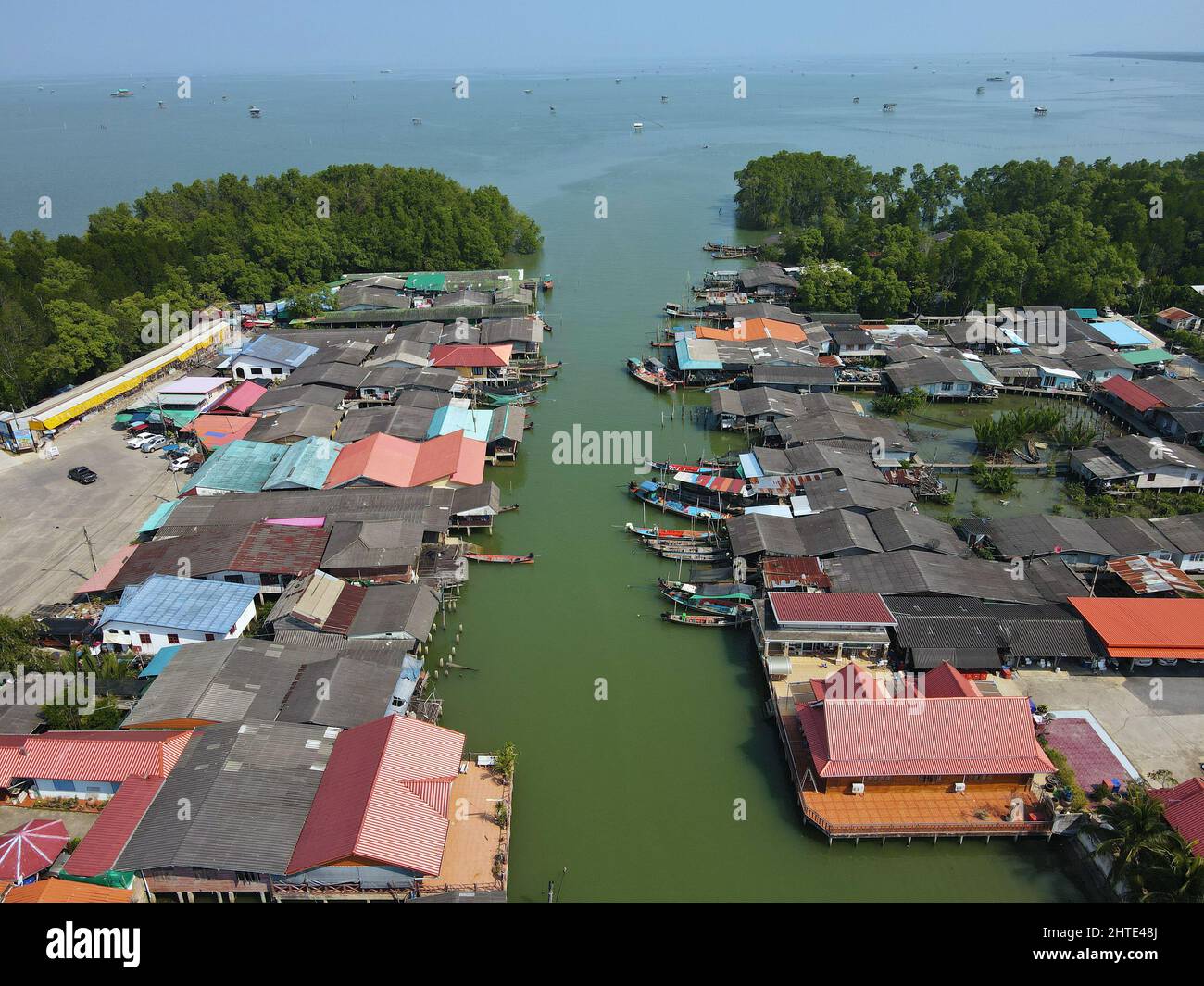 Aerial view of the Ban Pak Kradae fishing village with small houses and ...