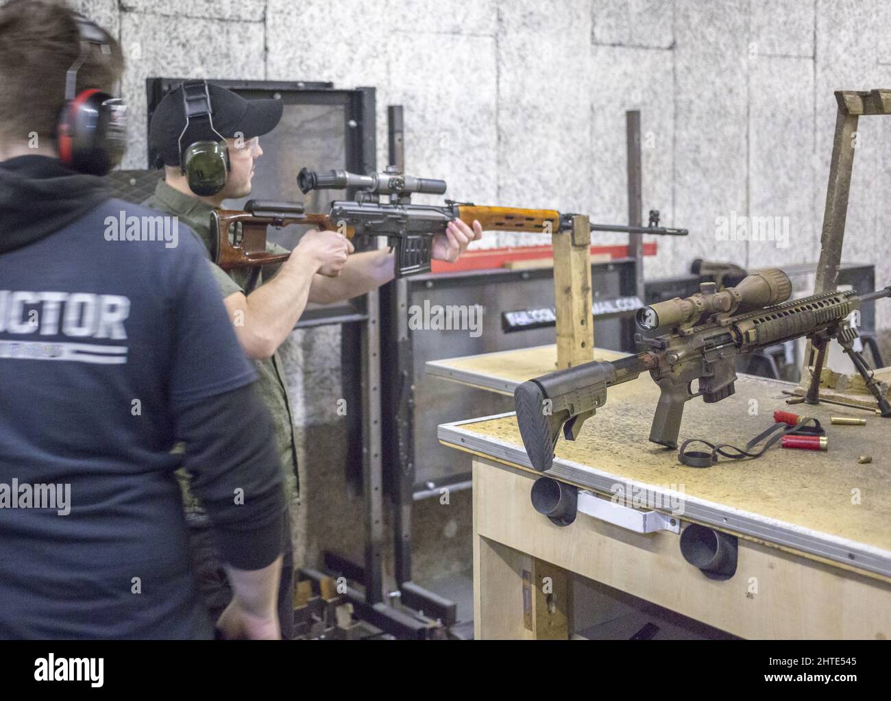 Professional Caucasian shooter in a shooting range Stock Photo - Alamy