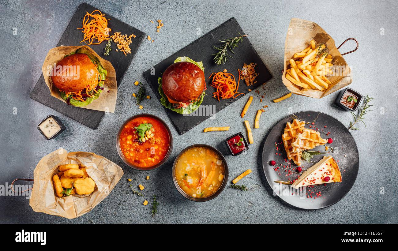 Top view of various food types soups, hamburgers, and dessert Stock ...