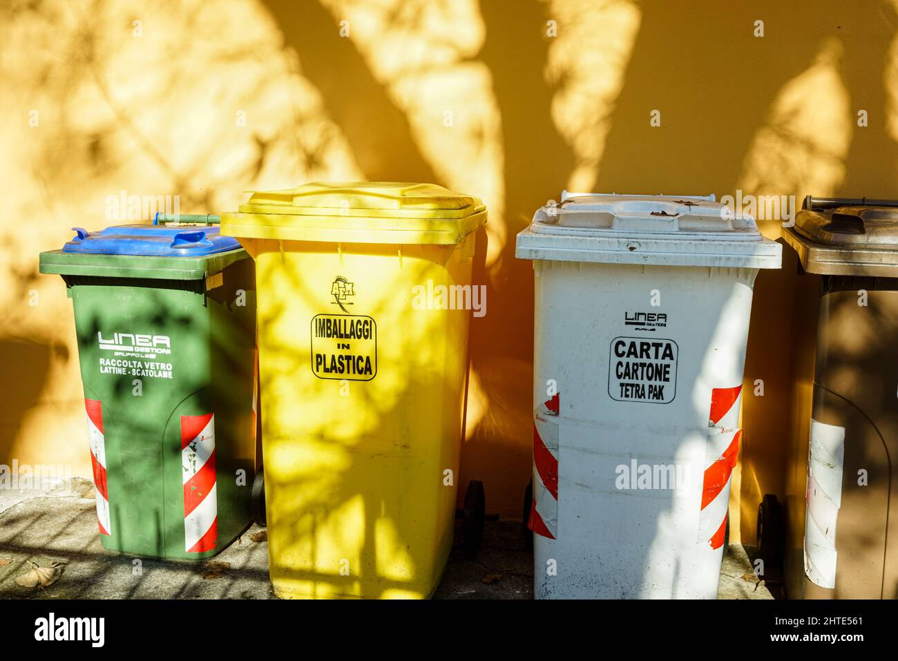 Shot of separated trash bins for waste management under the sunlight ...