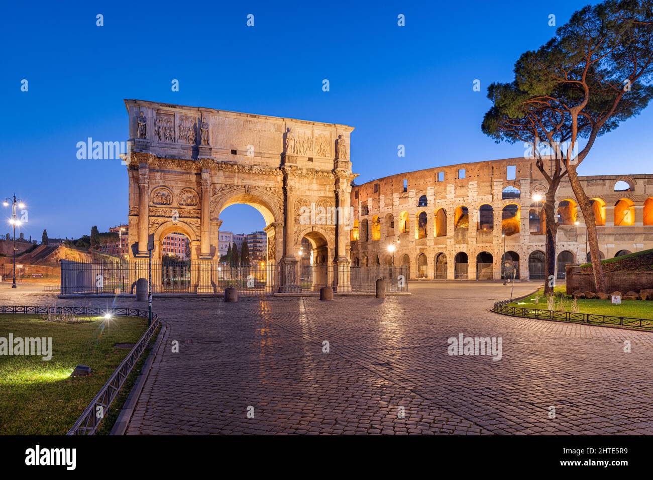 Rome, Italy at the Arch of Constantine and the Colosseum at twilight ...