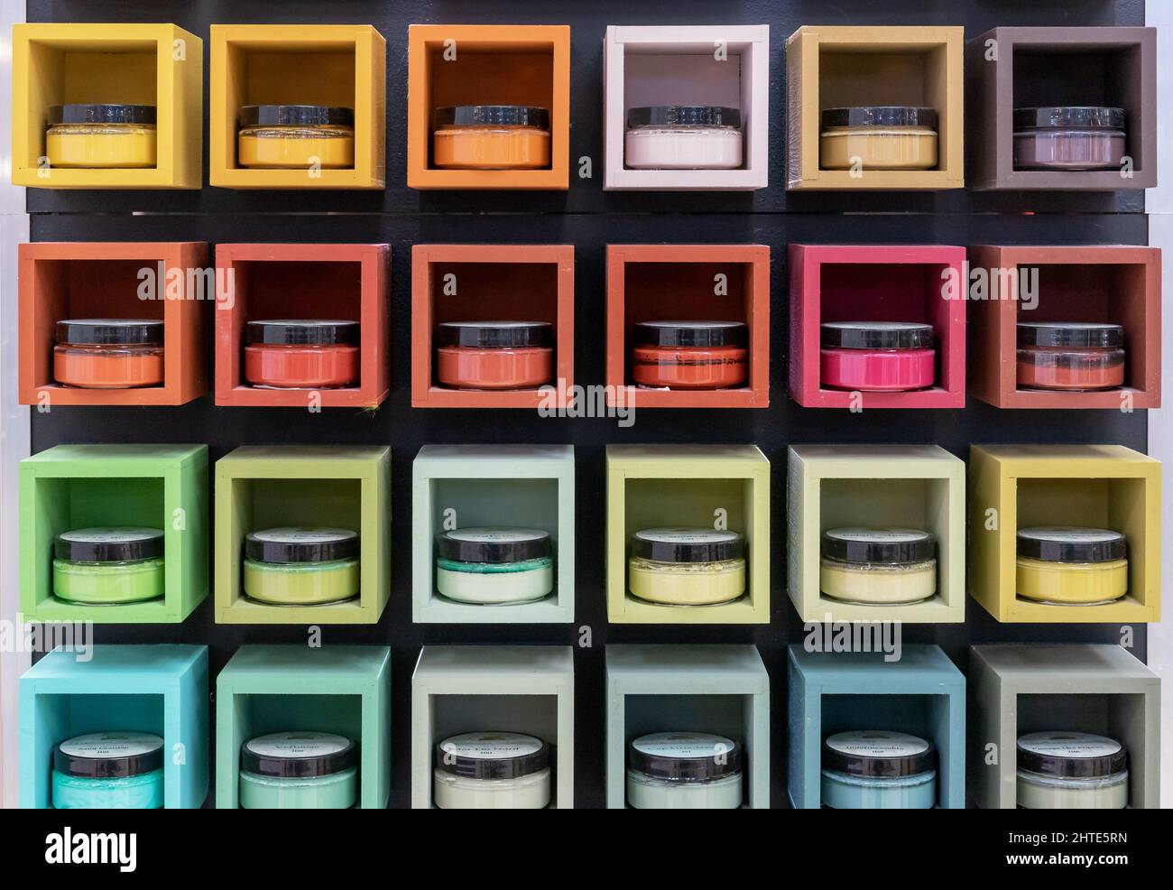 Cans with paint samples in wooden colored squares. Paint palette ...