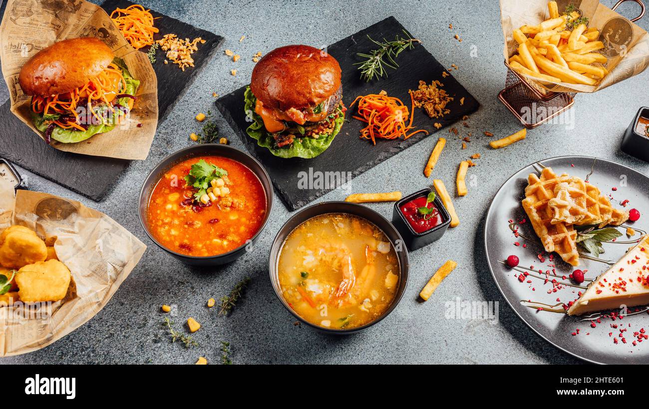 Top view of various food types soups, hamburgers, and dessert Stock ...