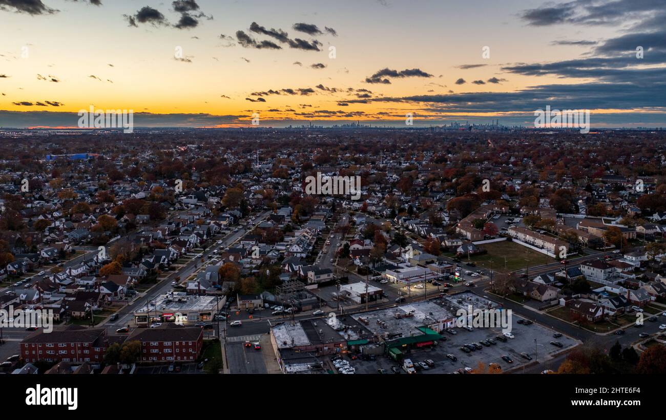Aerial view over Long Island in New York at sunset during fall time and ...