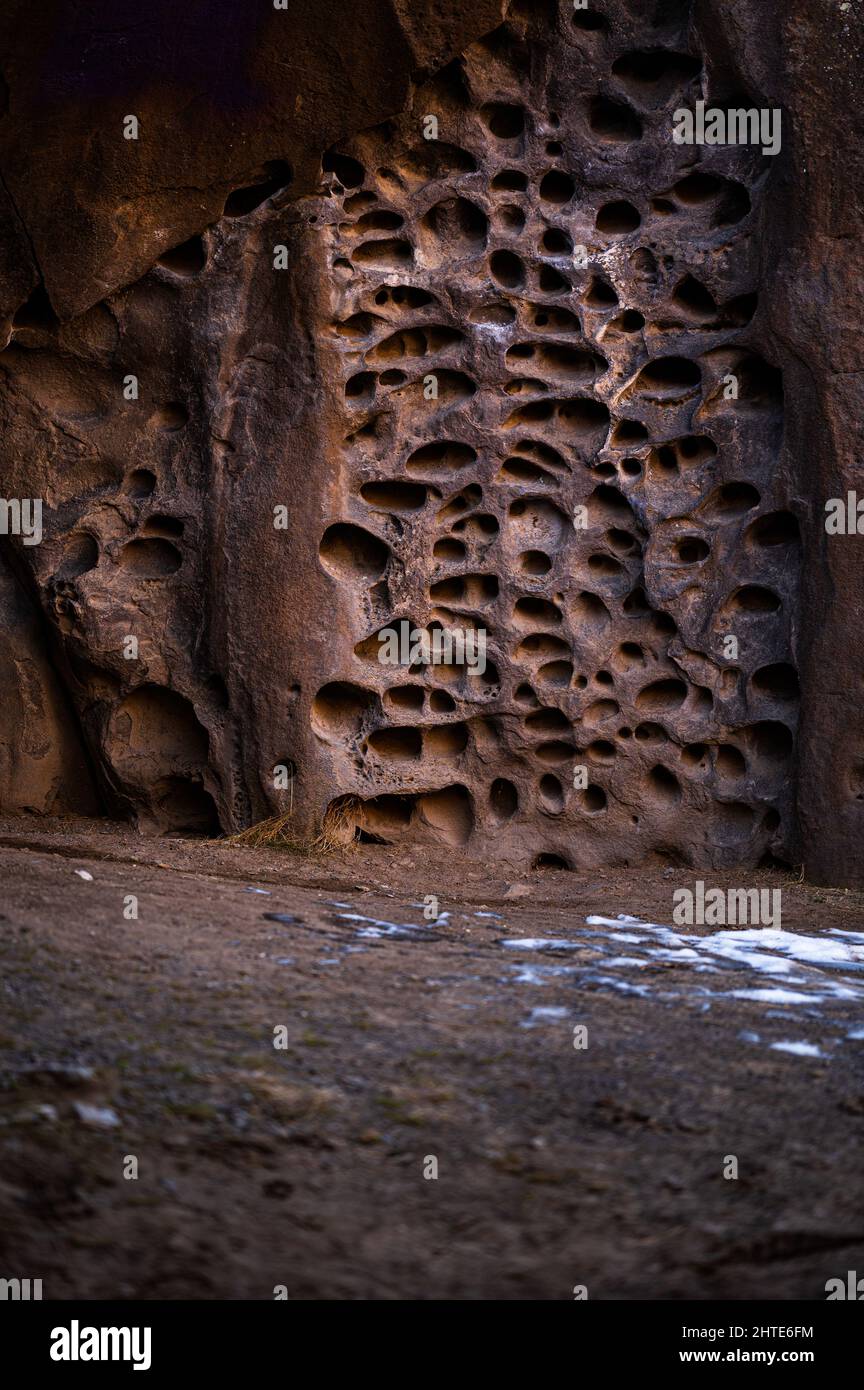 Closeup of a rock with holes Stock Photo - Alamy