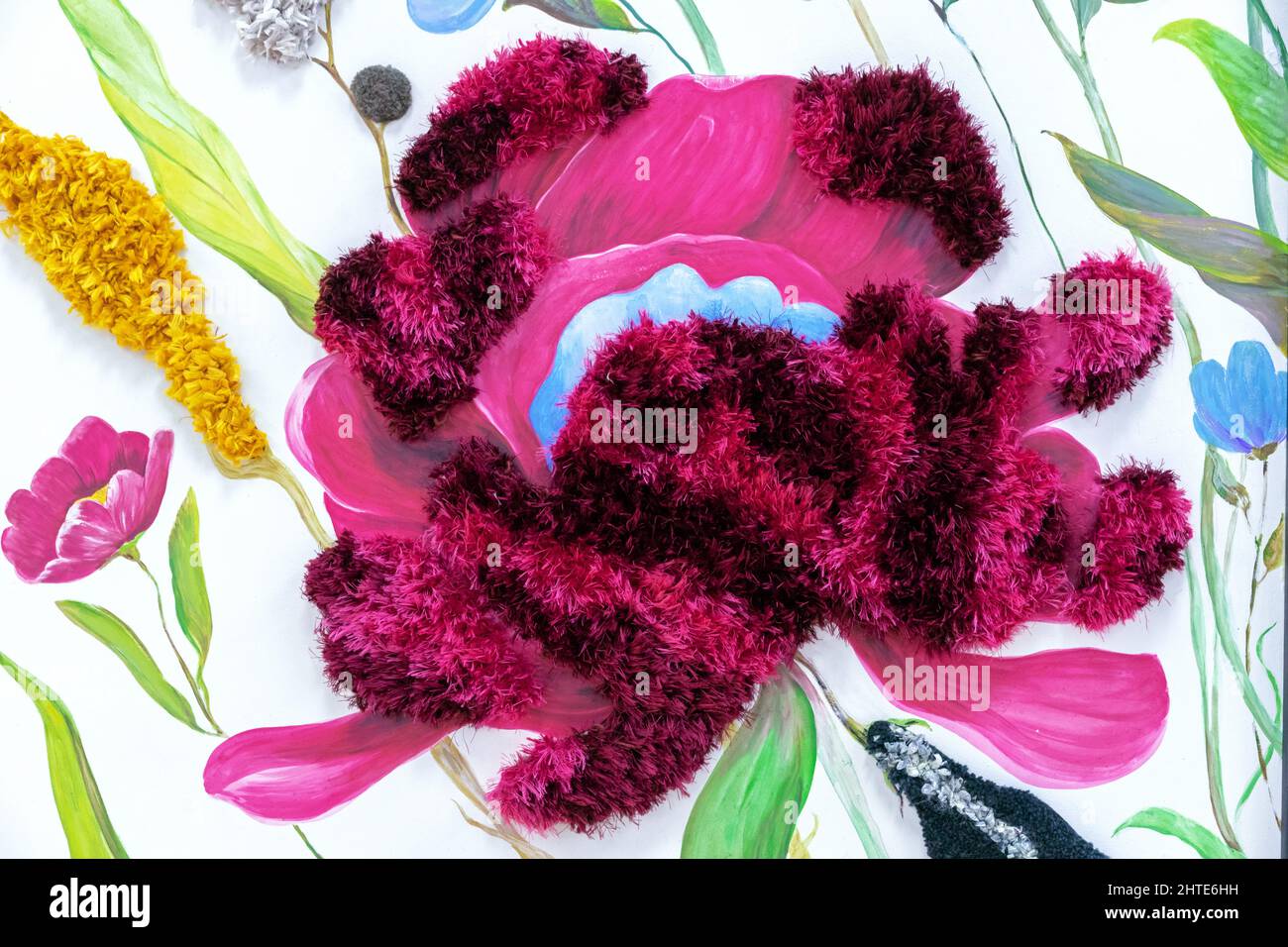Decorative purple faux fur flower. Wall panel with a shaggy flower ...