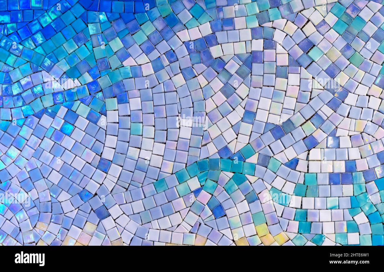 Ceramic mosaic tiles with white, blue and turquoise squares laid out in ...