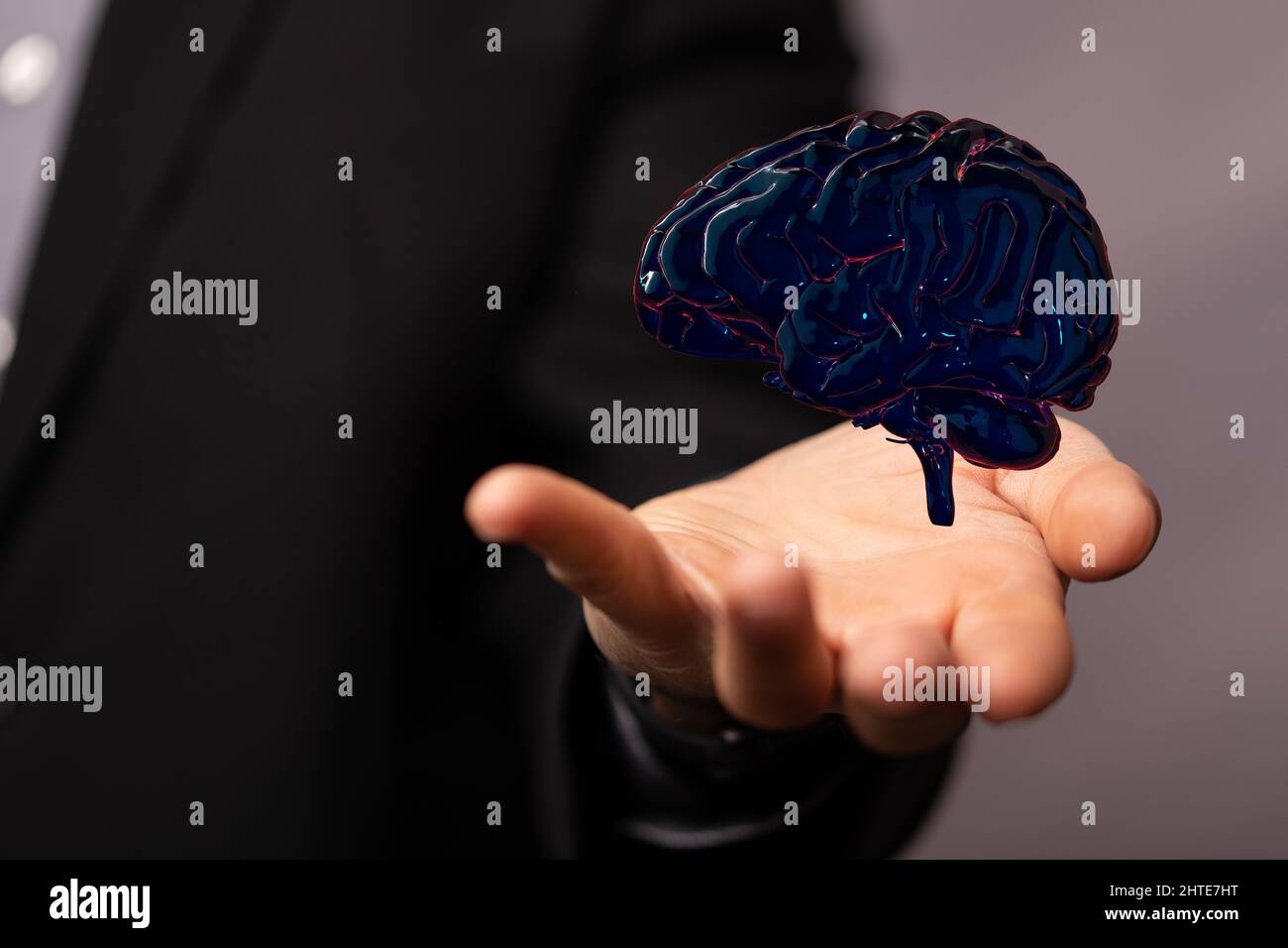Male in a suit displaying a brain network neurogenic digital IQ Stock ...