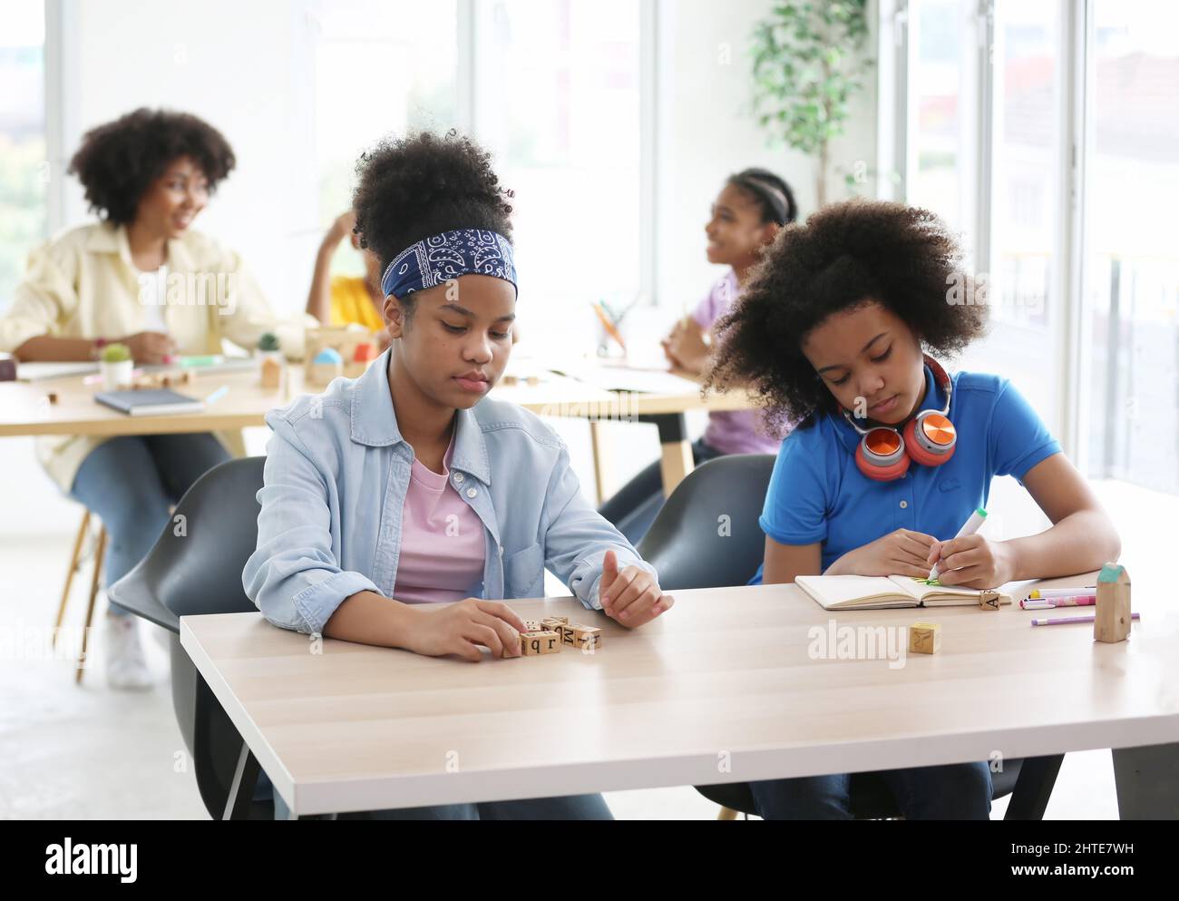 Diverse children playing in classroom hi-res stock photography and ...