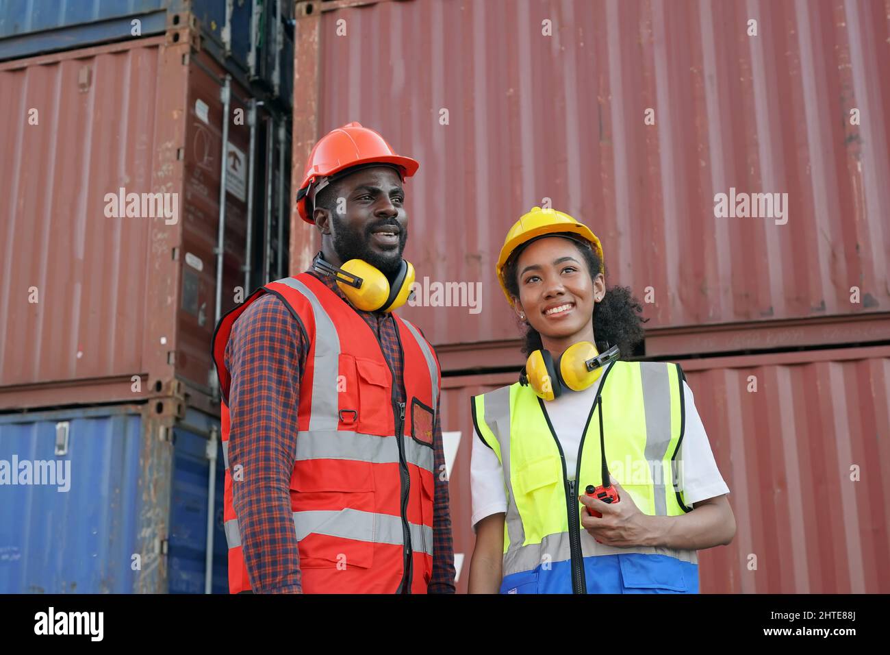 Foreman control Industrial Container Cargo freight ship at industry ...