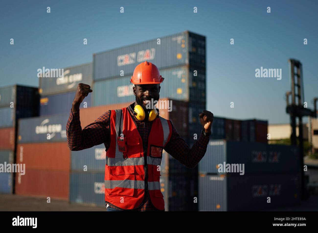 Foreman control Industrial Container Cargo freight ship at industry ...