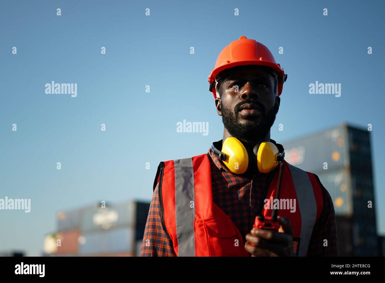 Foreman control Industrial Container Cargo freight ship at industry ...