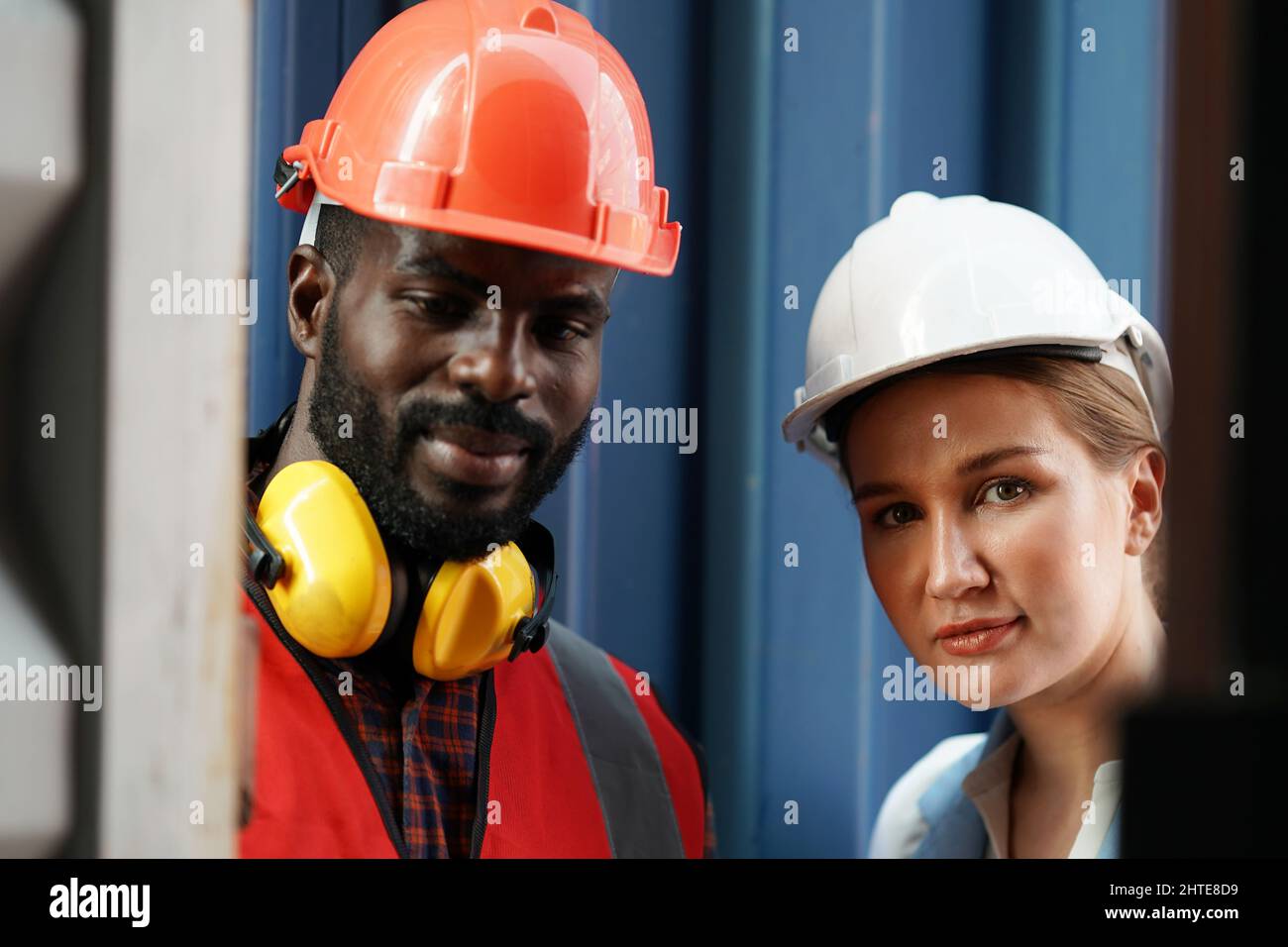 Foreman control Industrial Container Cargo freight ship at industry ...