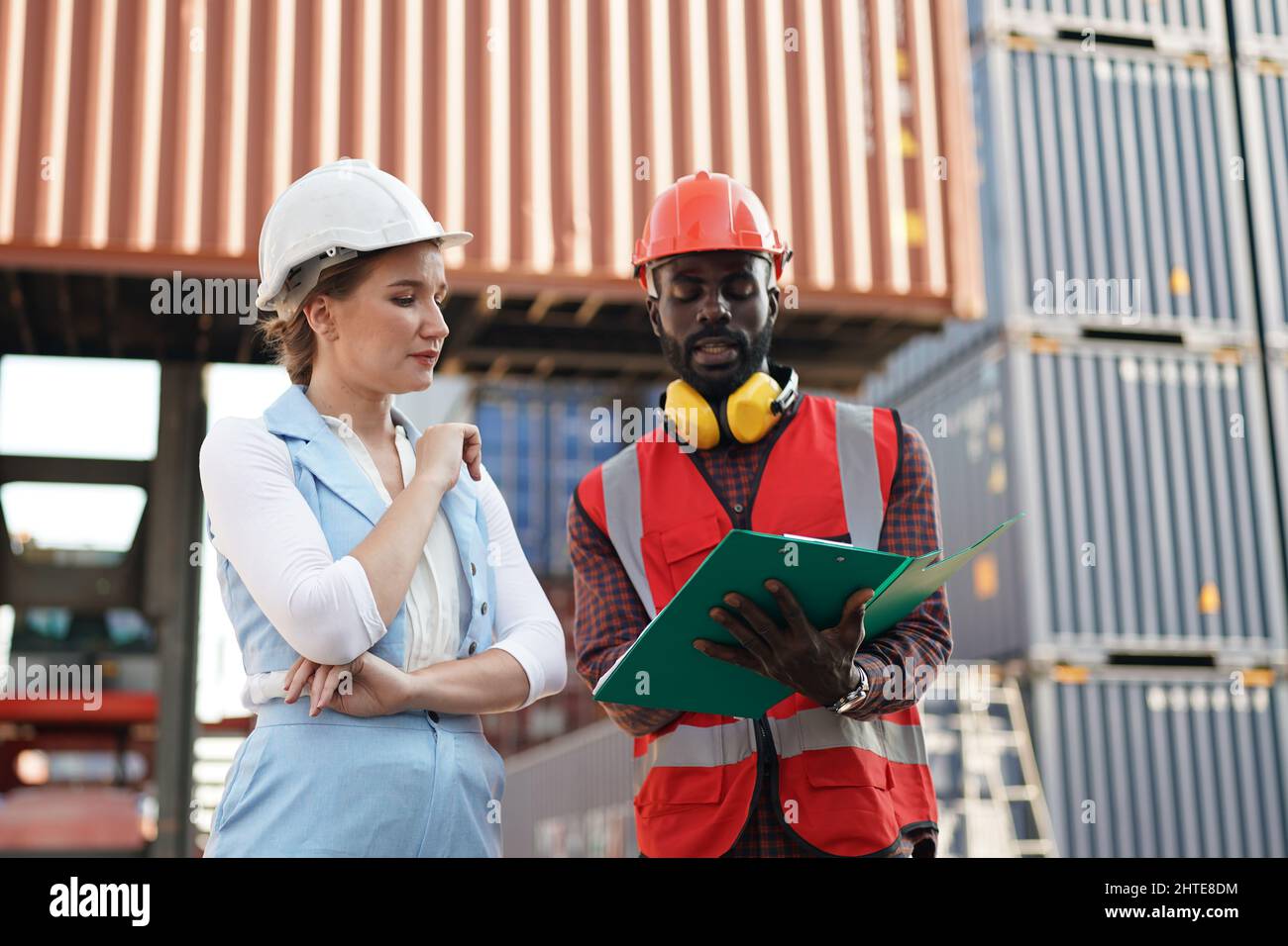 Foreman control Industrial Container Cargo freight ship at industry ...