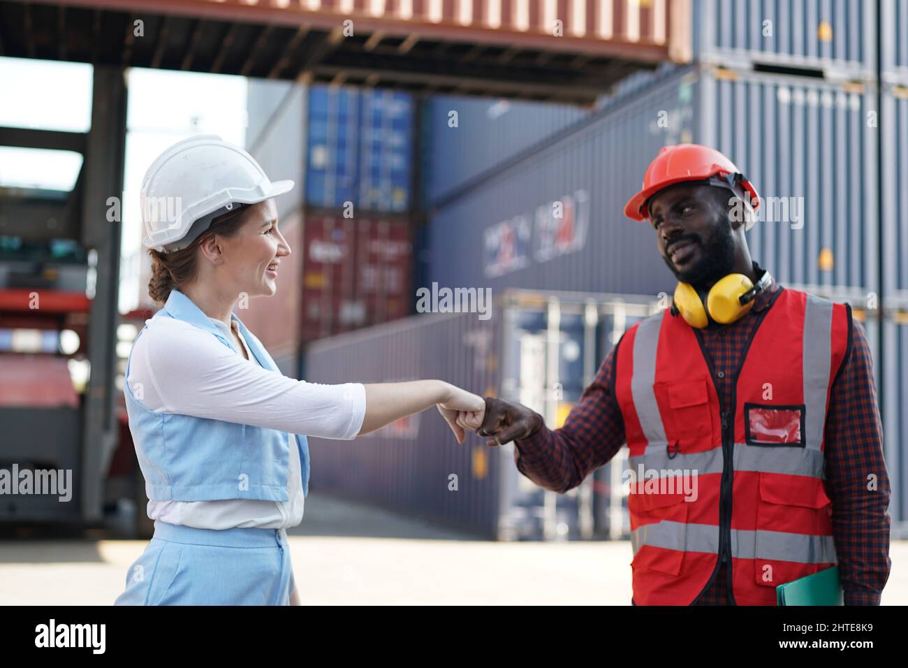 Foreman control Industrial Container Cargo freight ship at industry ...