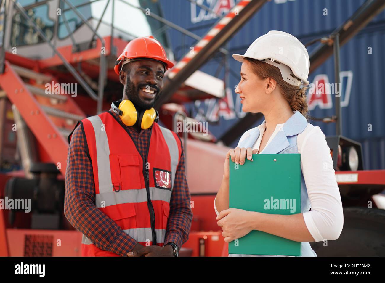 Foreman control Industrial Container Cargo freight ship at industry ...