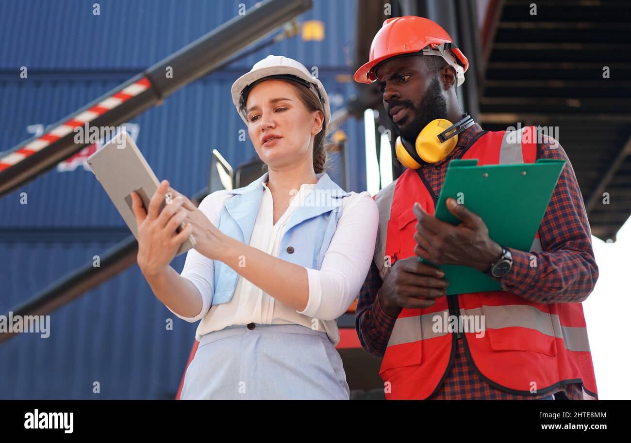 Foreman control Industrial Container Cargo freight ship at industry ...