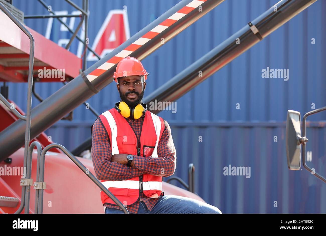 Foreman control Industrial Container Cargo freight ship at industry ...