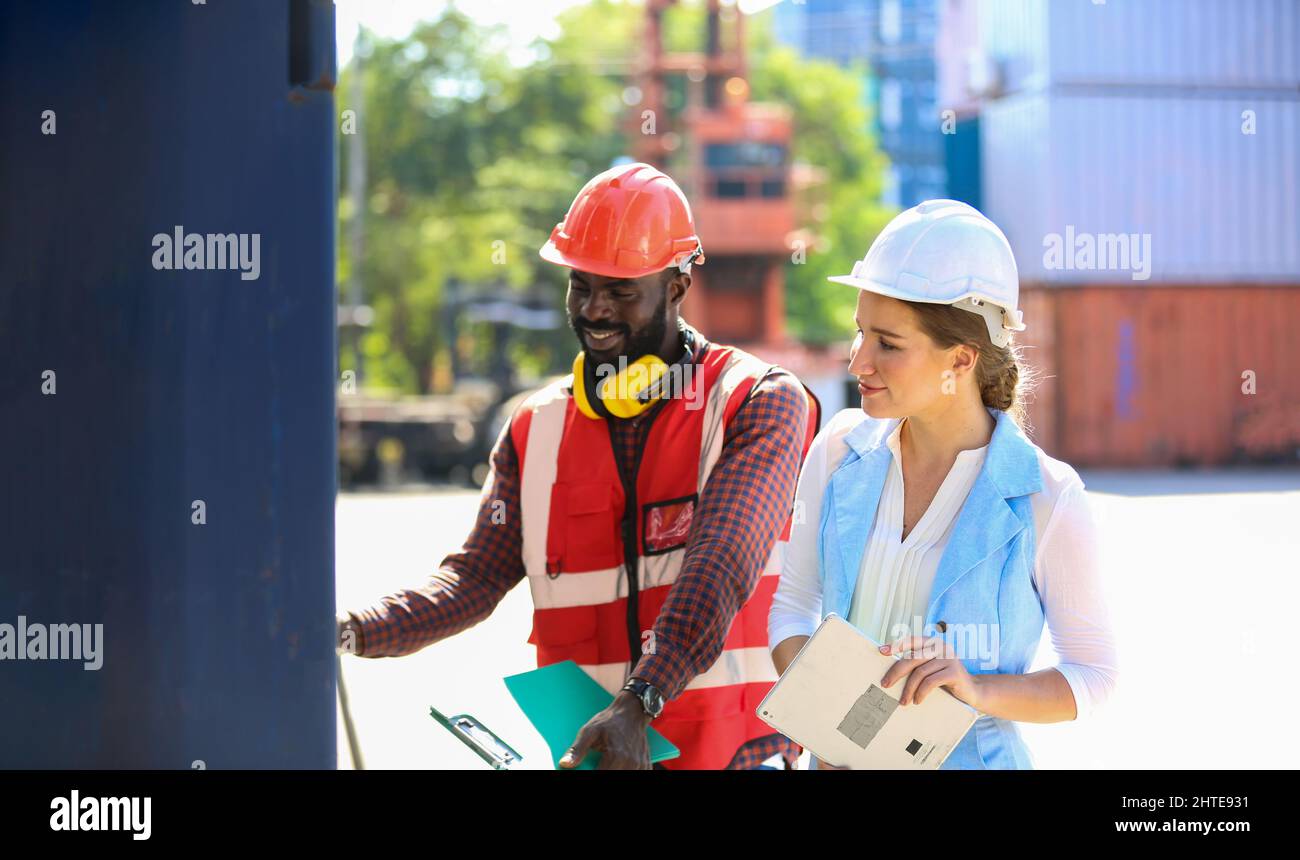 Foreman control Industrial Container Cargo freight ship at industry ...