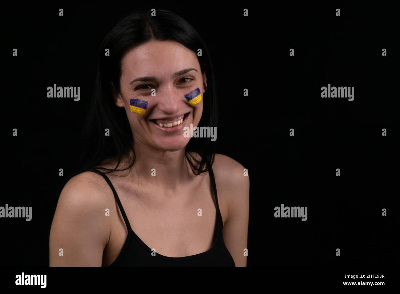 Portrait of beautiful adult Ukrainian woman with yellow blue flag on ...
