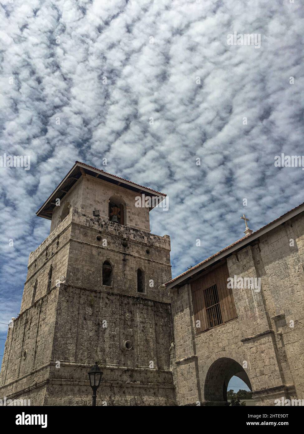 Low angle shot of the Baclayon Church in the Philippines and a cloudy ...