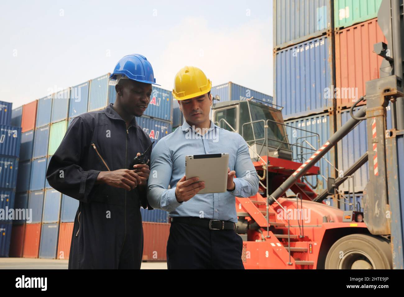 Foreman control Industrial Container Cargo freight ship at industry ...