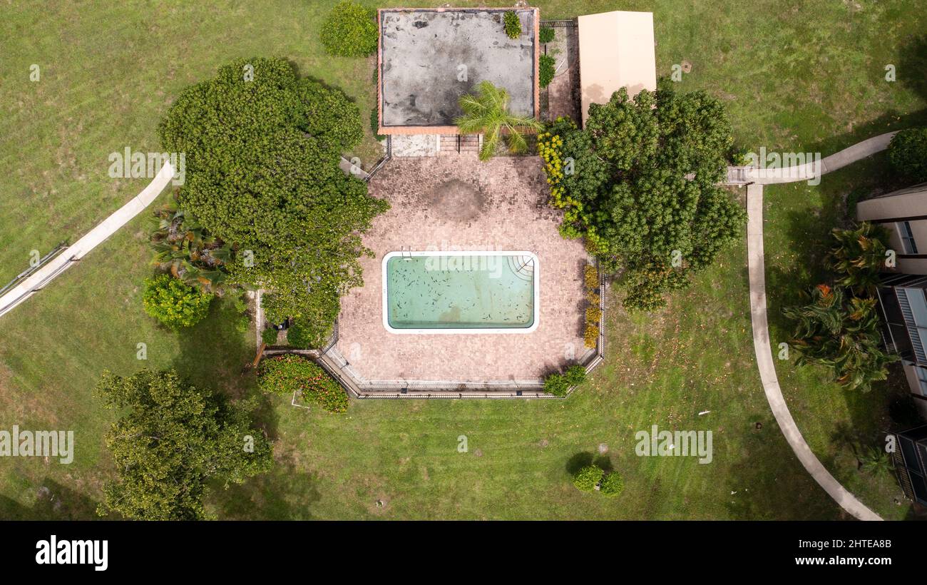 Drone shot of a swimming pool and surrounding areas in an apartment ...