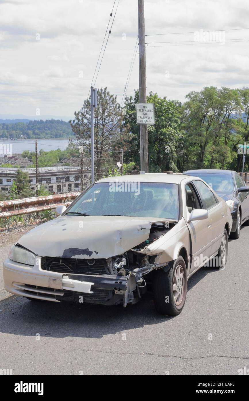 Vertical shot of a Toyota Sedan with accident damage Stock Photo - Alamy