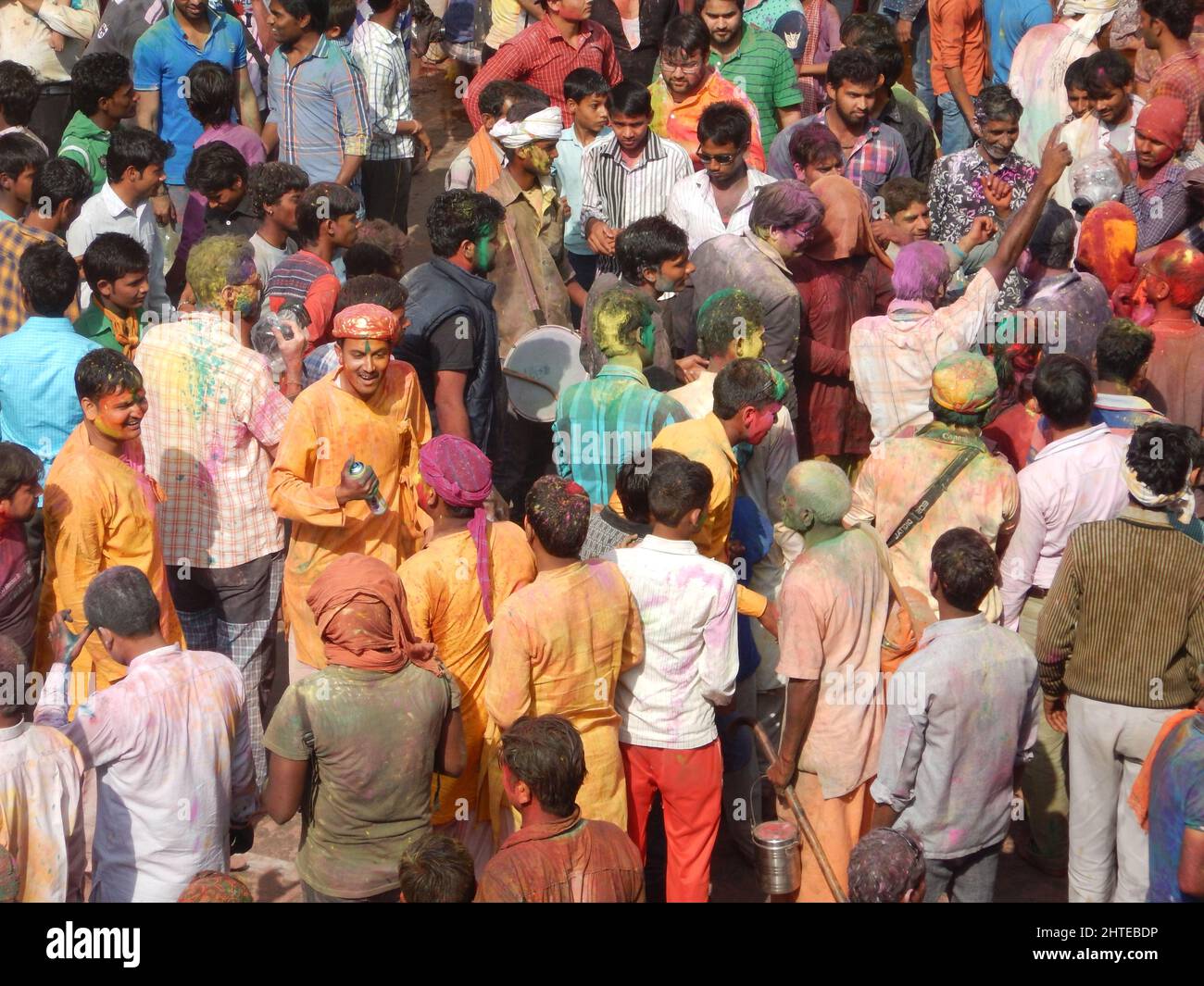 People covered with colors, celebrating the Holi Hindu festival in Lord ...