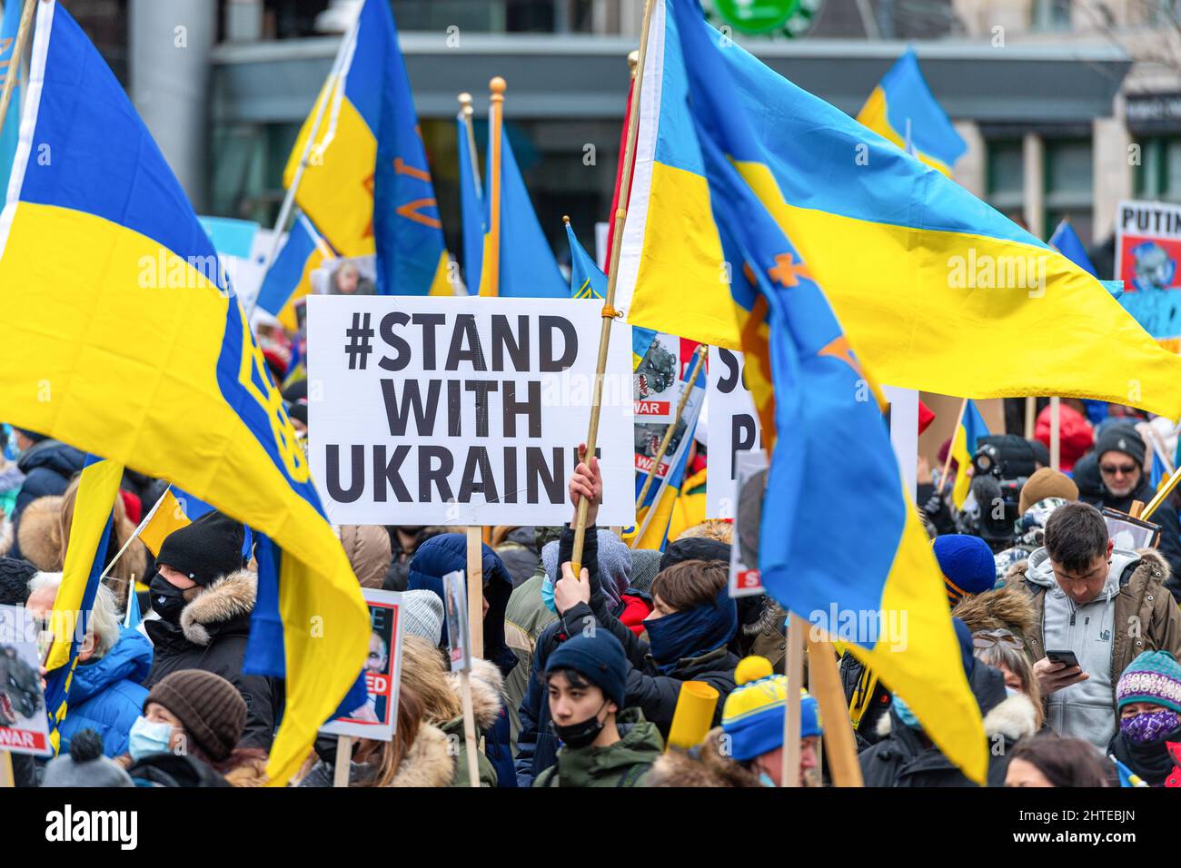 Toronto, Canada - February 27, 2022: Group of Ukrainian flags held by a ...